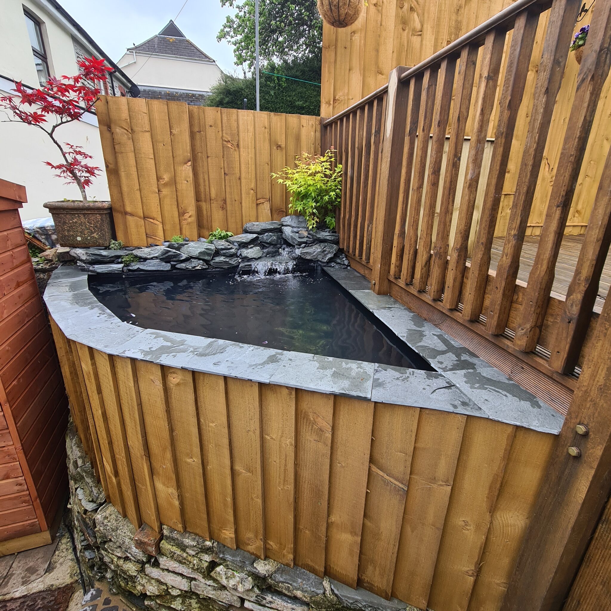 Raised Wooden Pond With A Waterfall - Specialist Aquatics Solutions